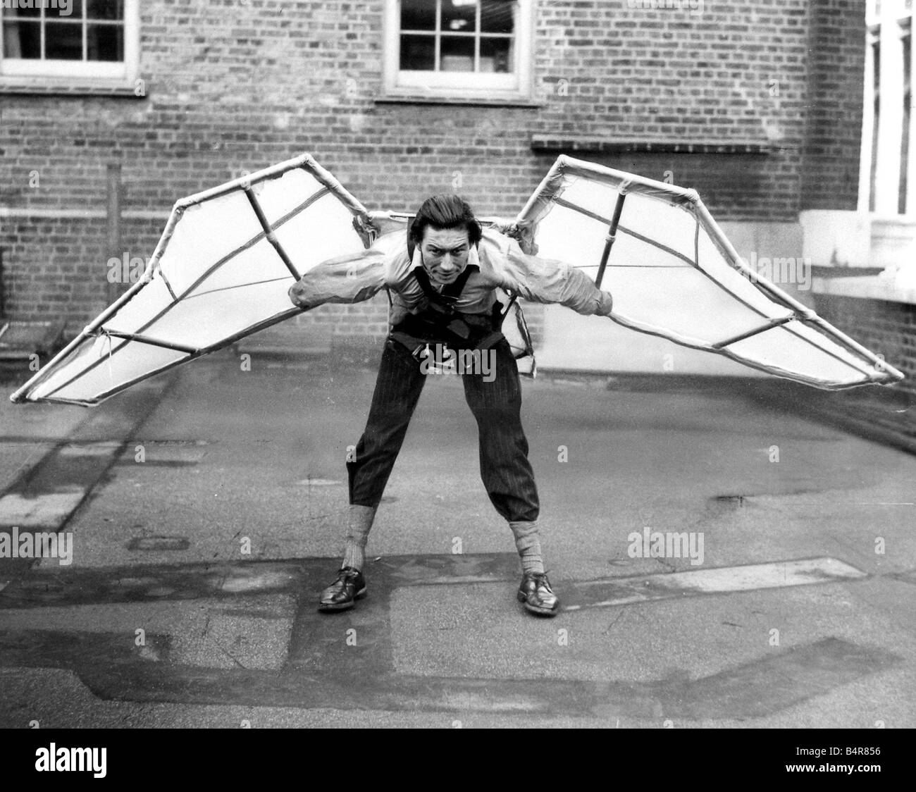 Flying man wings Black and White Stock Photos & Images - Alamy