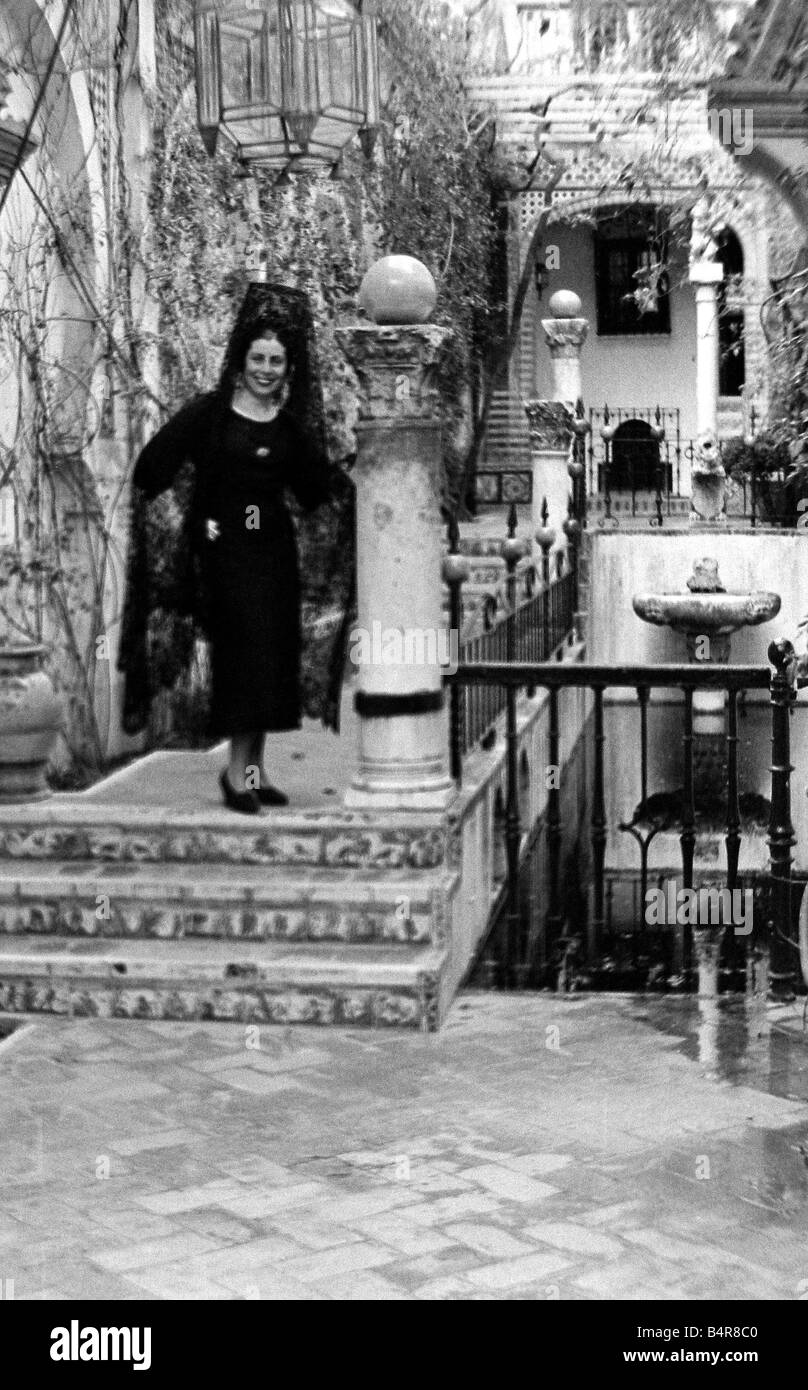 Widow in Seville Spain Woman wearing black dress and veil on balcony ...
