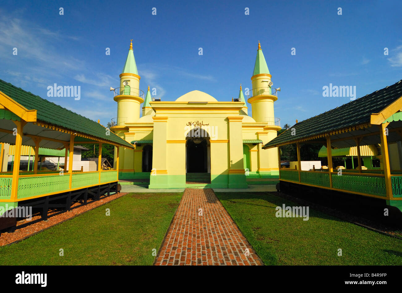 Green and yellow is the dominant colour of Sultan Riau Grand Mosque ...