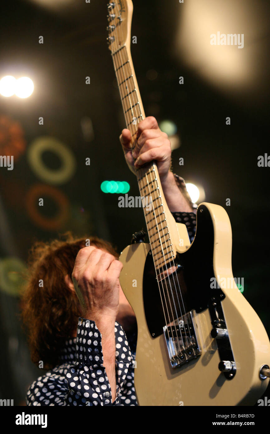 Guitarist performing a stunning solo on stage Stock Photo - Alamy