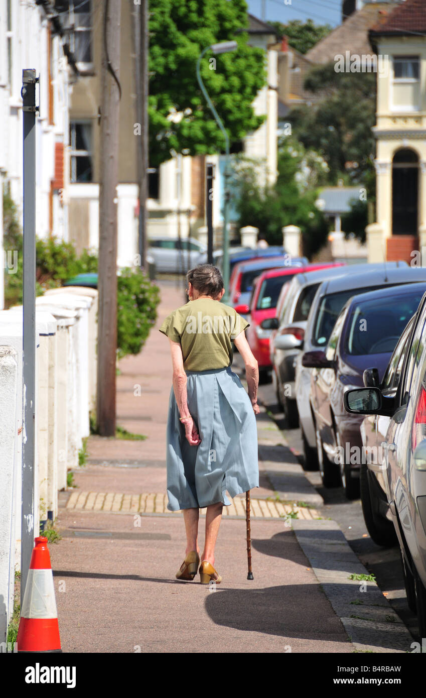 An old lady pensioner on her walk in the city of Brighton and Hove ...