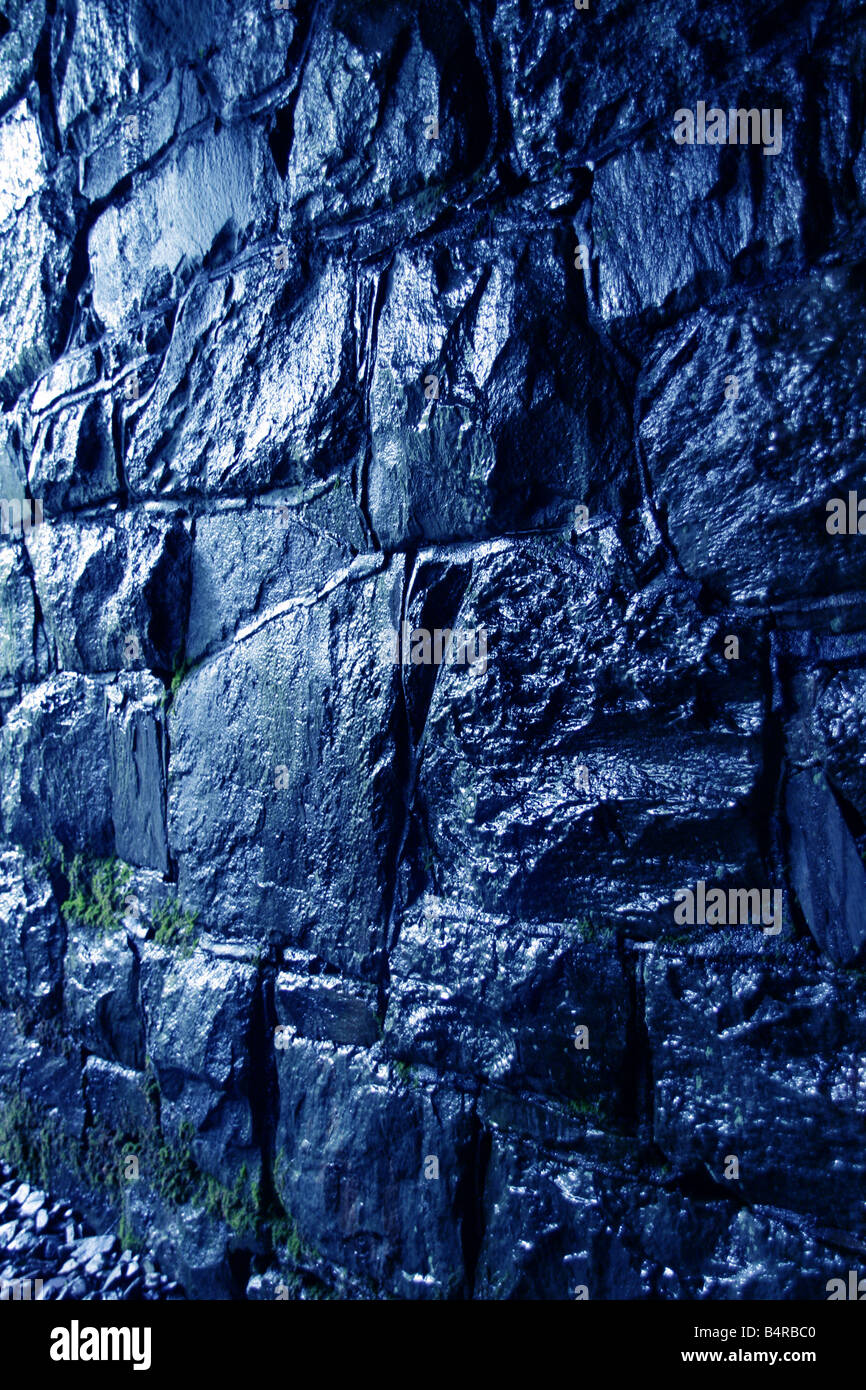 detail of dark damp wet stone wall in alley way Stock Photo - Alamy