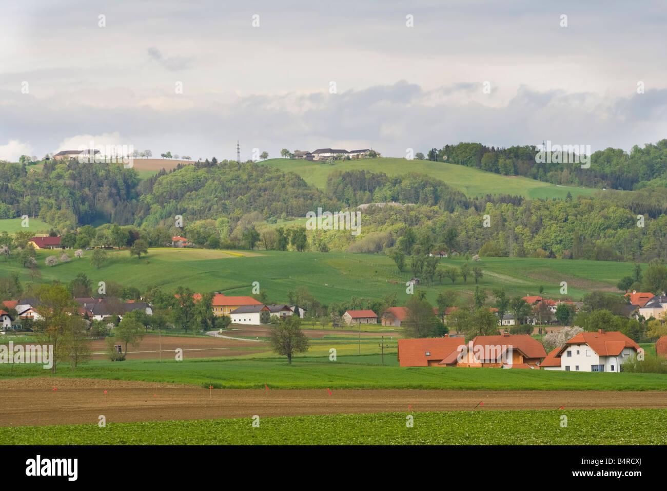 Houses in field Stock Photo - Alamy