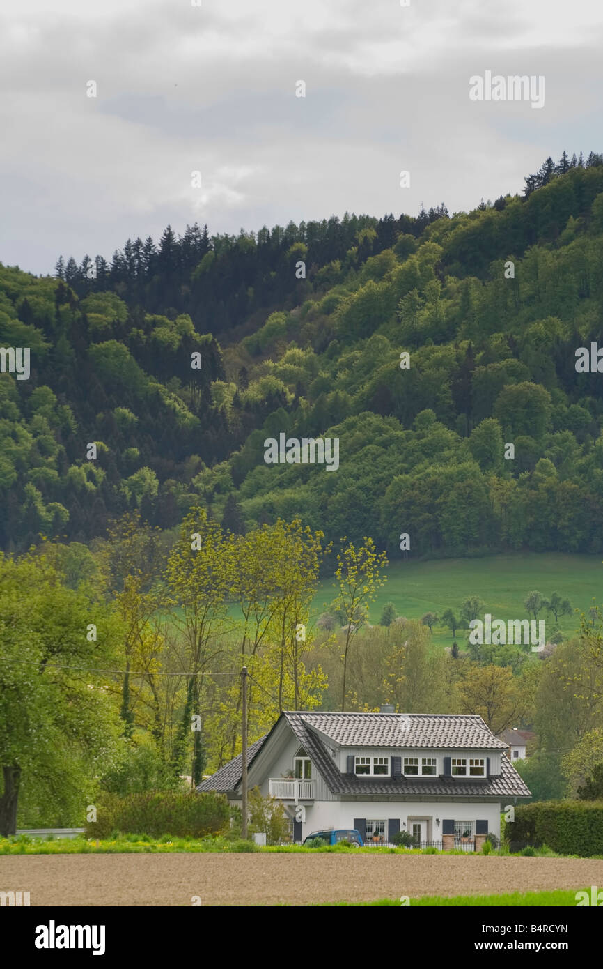 House in field Stock Photo - Alamy