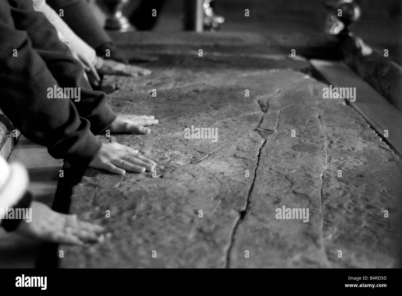 Pilgrims touch the tablet where Jesus' body was placed before being ...