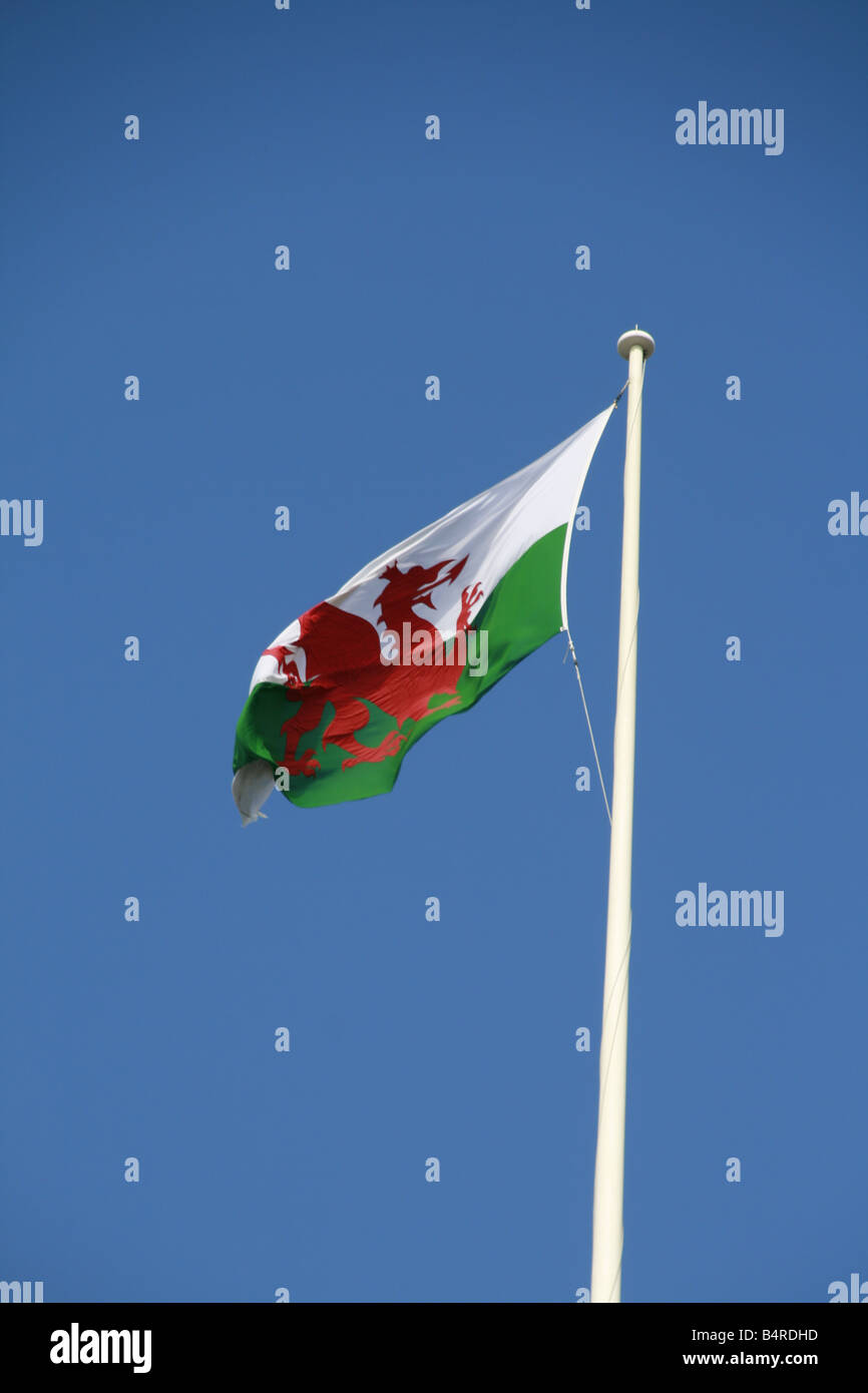 welsh banner on flagpole in blue sky in sun Stock Photo - Alamy
