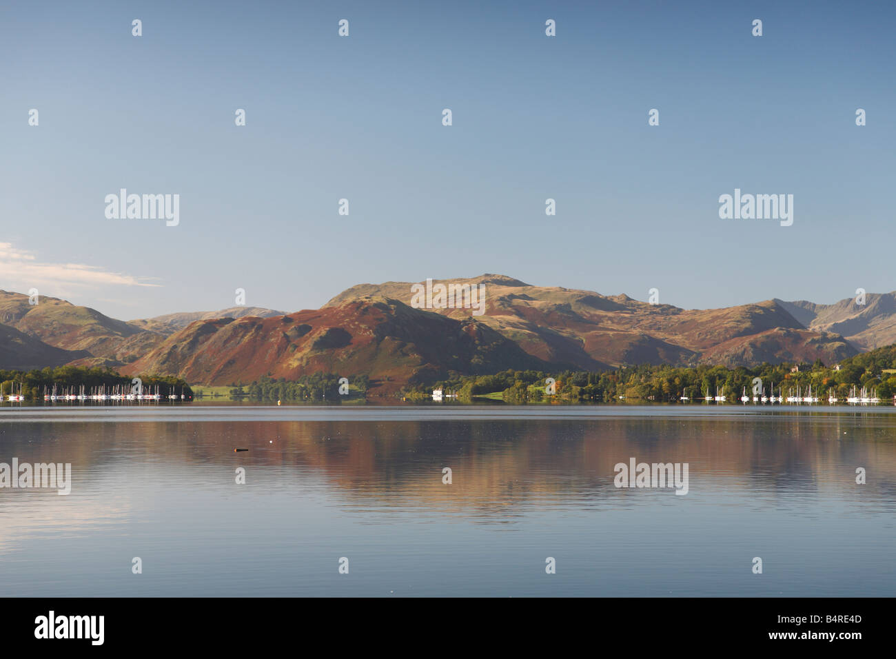 Lake scene with trees and hills. Pooley Bridge, The Lake District ...