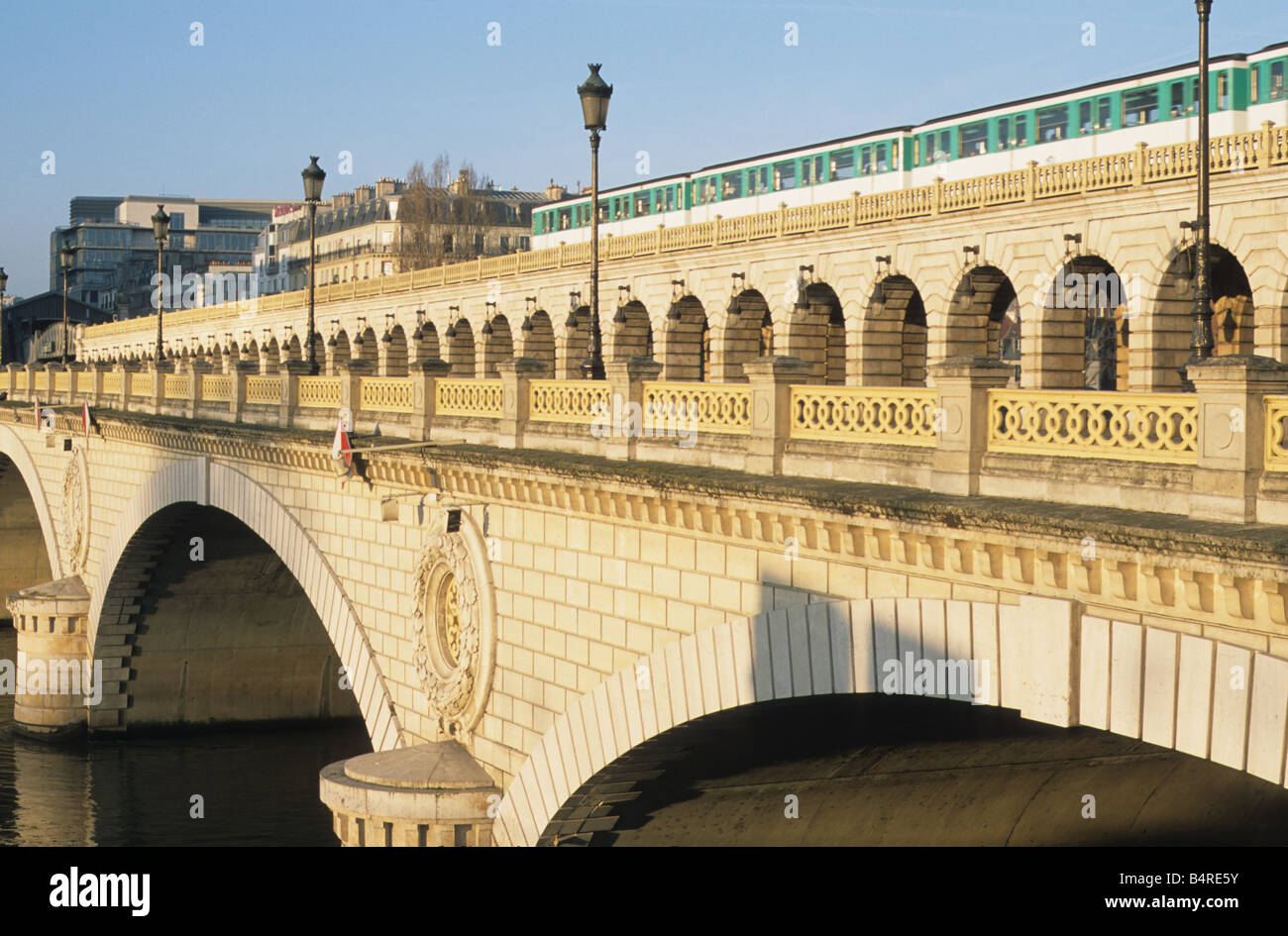 Metro train crossing Pont de Bercy, over the river Seine, Paris, France ...