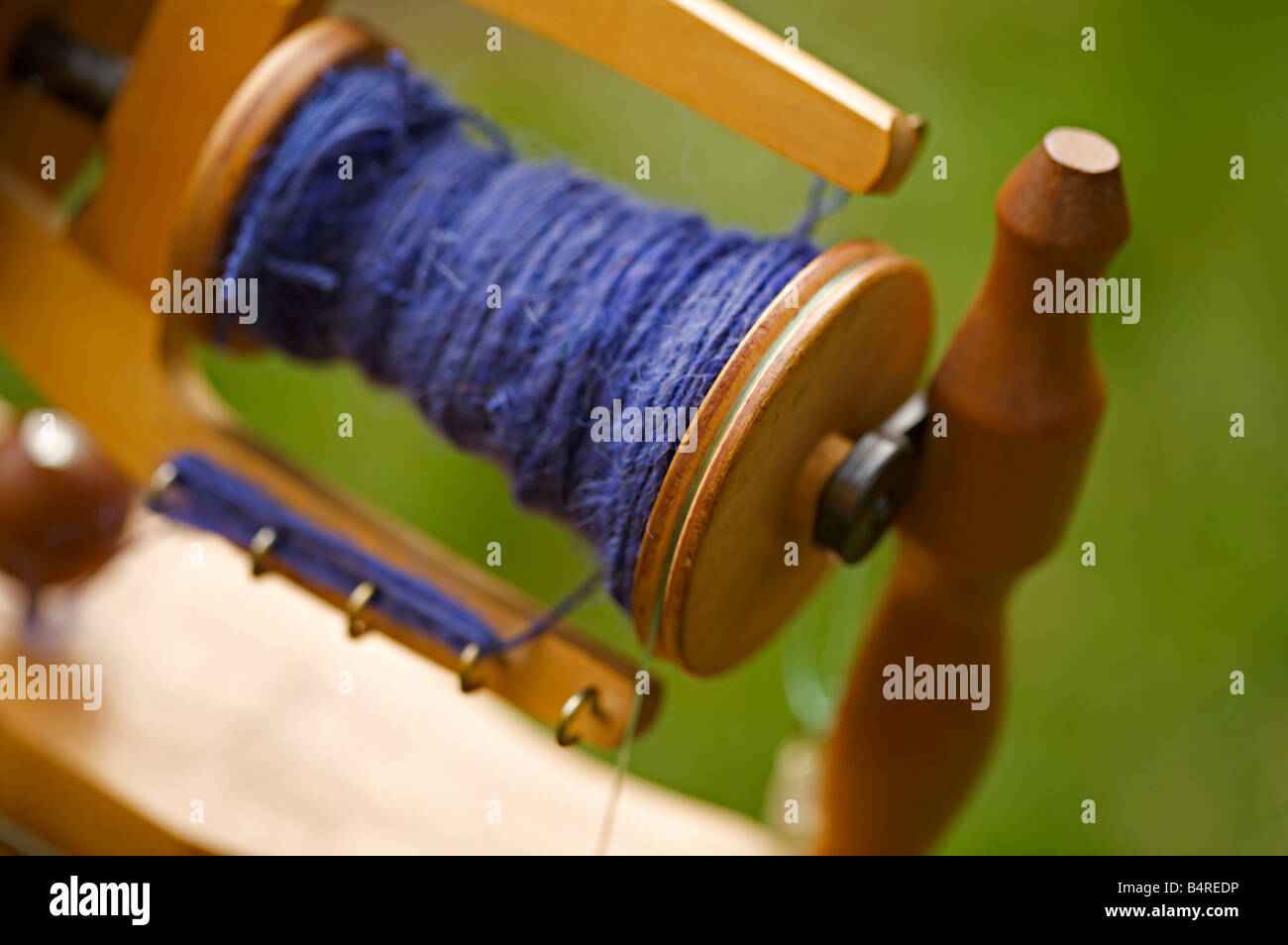 Spinnning wheel and "Alpaca fiber" close-up Stock Photo - Alamy