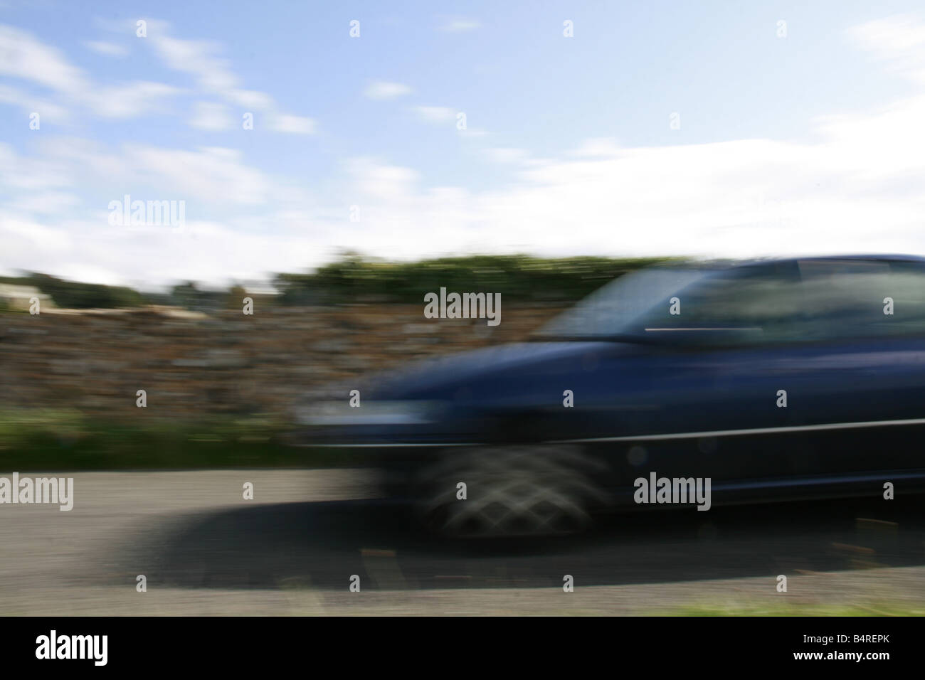 fast car on country lane with motion blur Stock Photo - Alamy