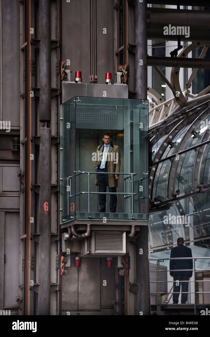 Man inside glass external elevator at the Lloyds Insurance building in ...