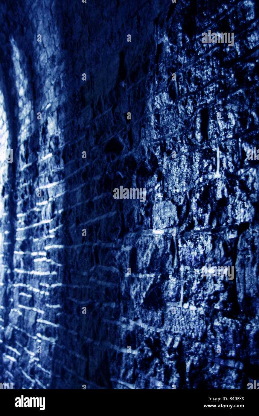 detail of dark damp wet stone wall in alley way Stock Photo - Alamy