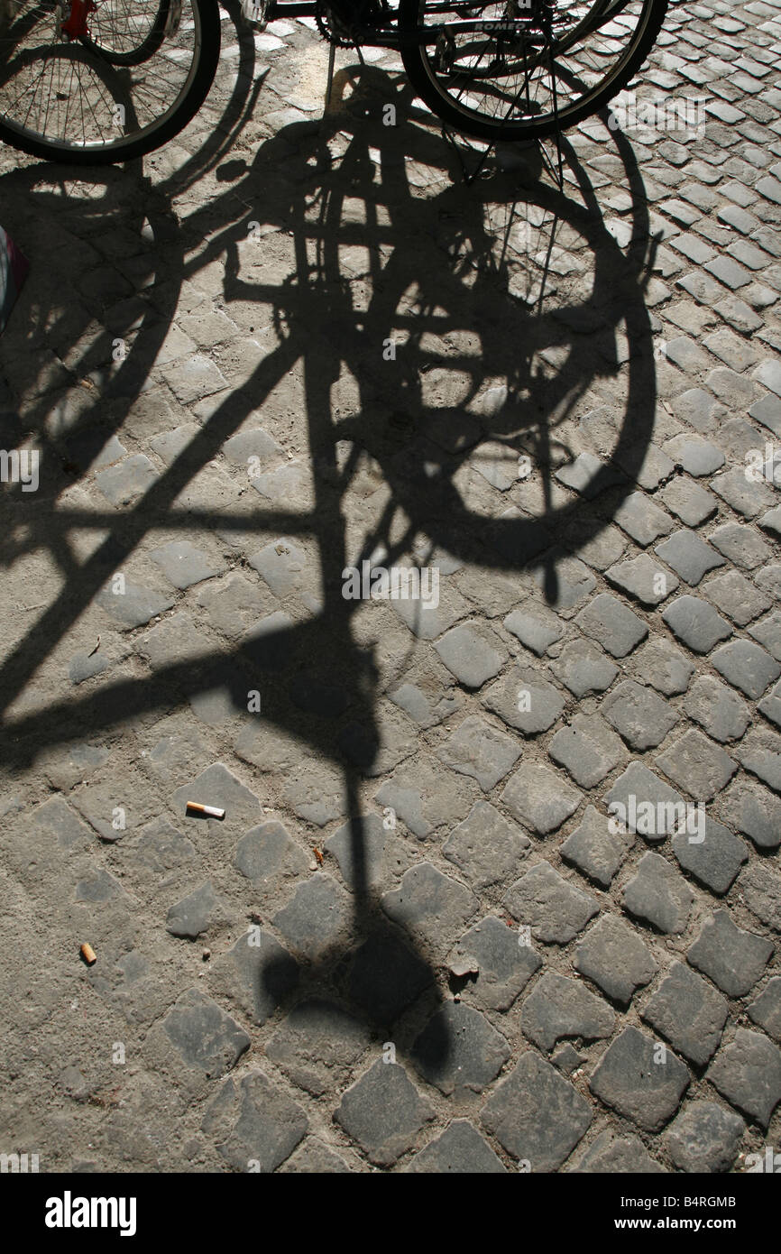 bikes shadow on sidewalk road in sun Stock Photo - Alamy
