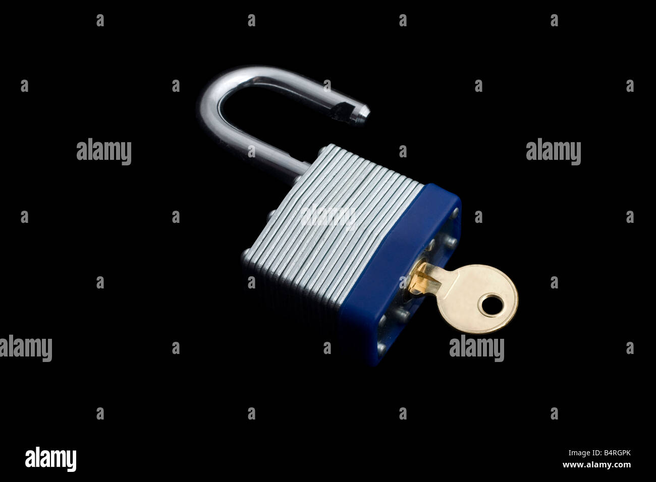 open metal lock with key isolated on black background Stock Photo - Alamy