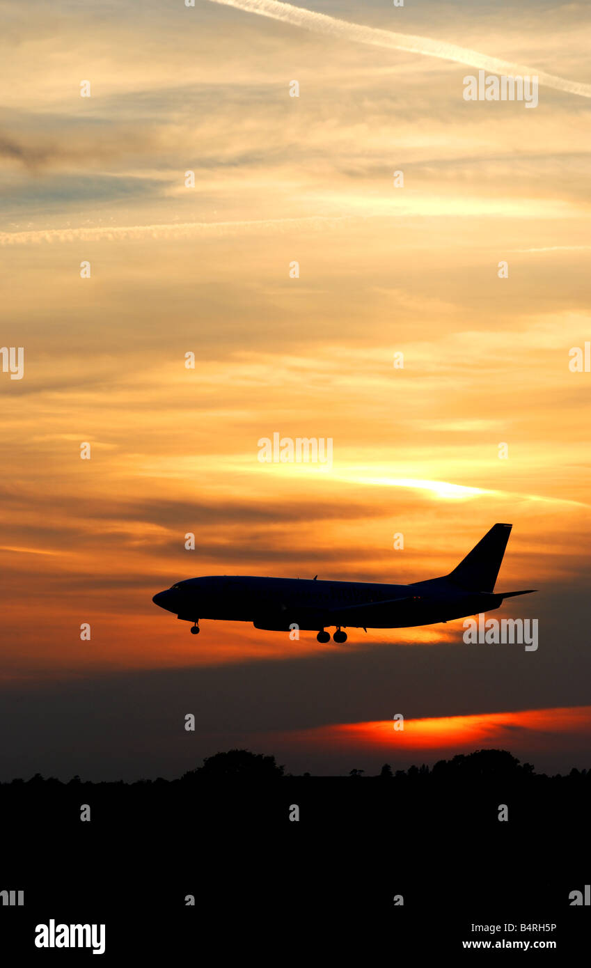 bmibaby Boeing 737 aircraft landing at sunset at Birmingham ...