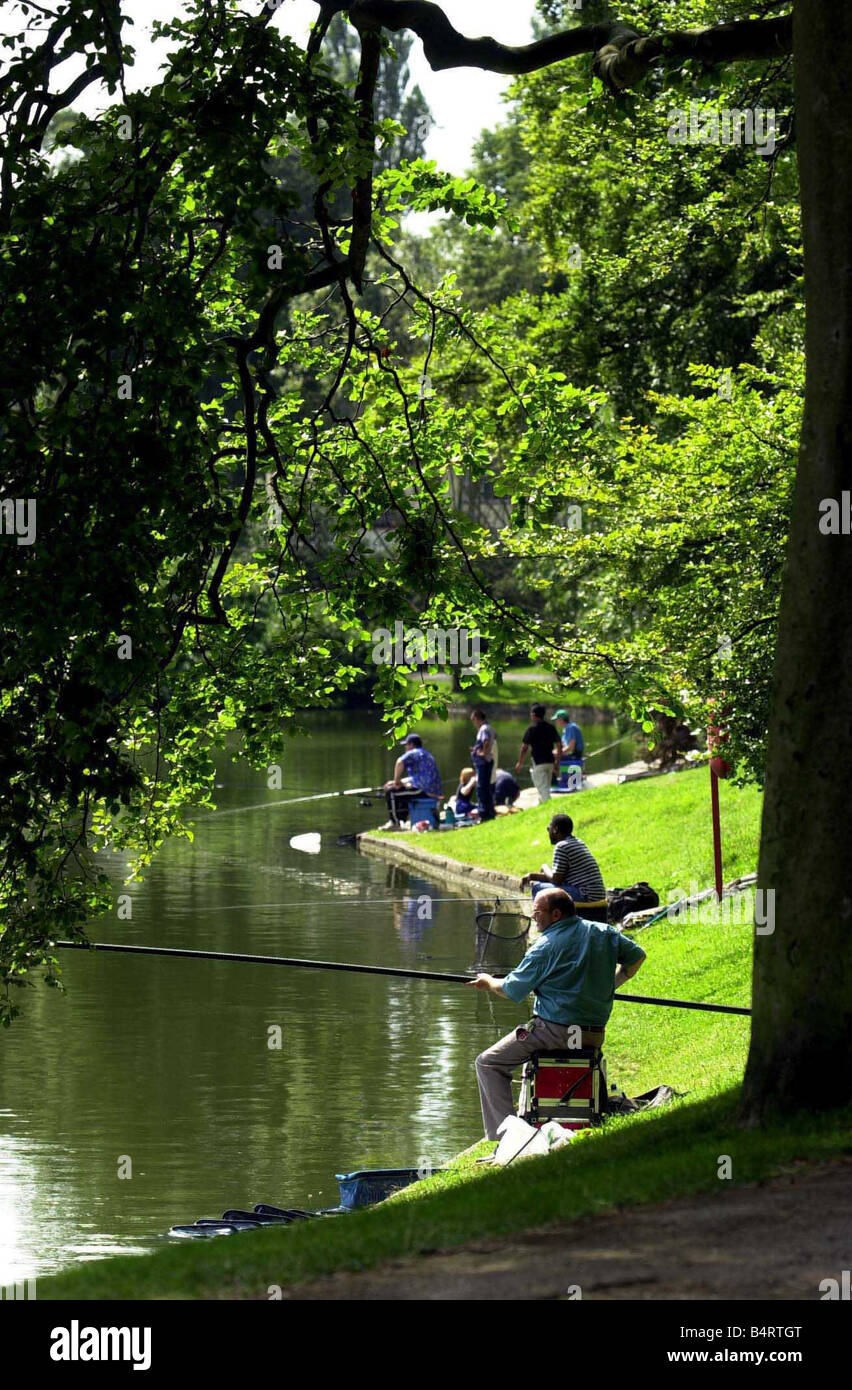 Summer scene in Swanshurst Park Hall Green where locals take advantage ...