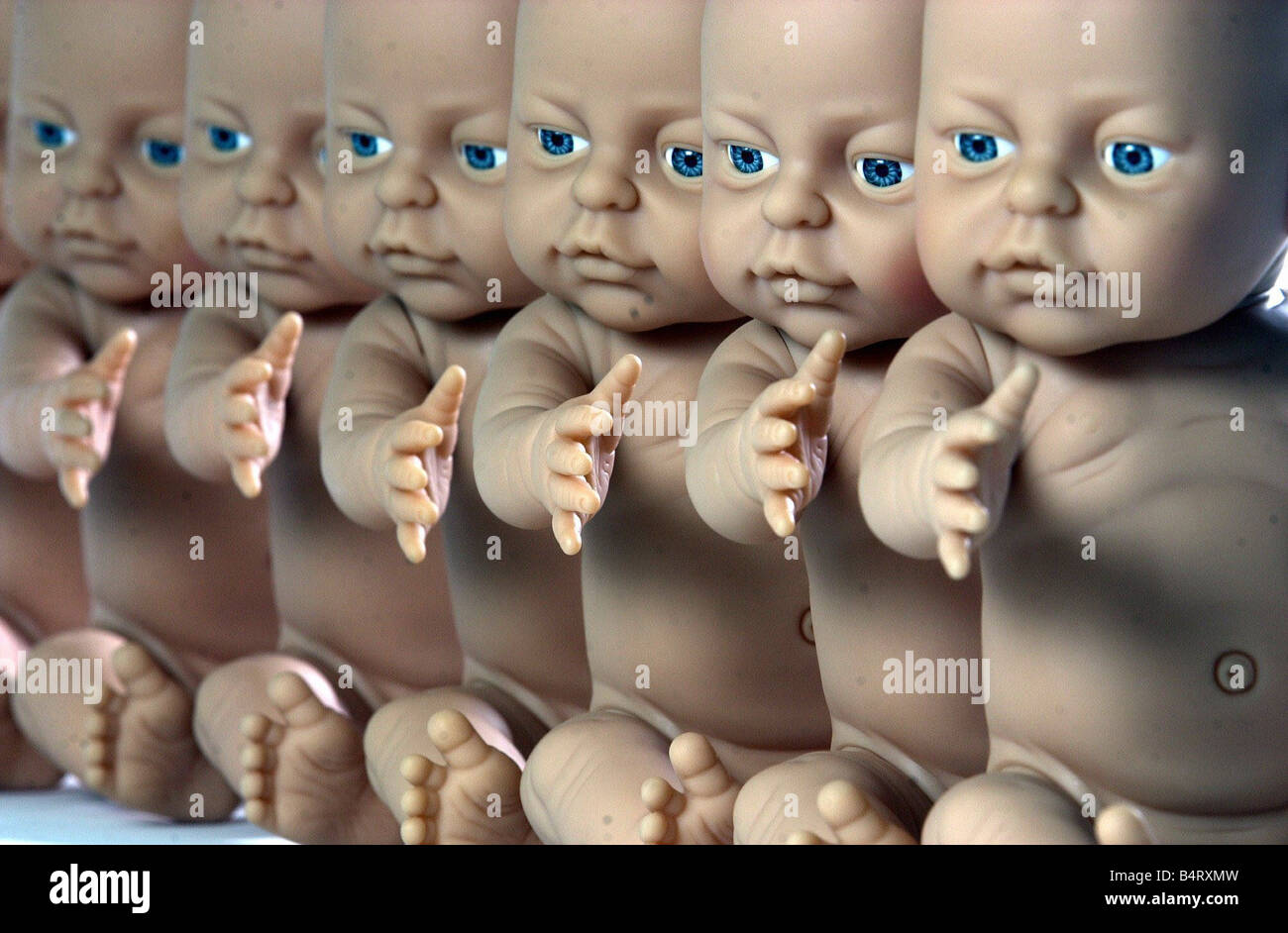 Models of small babies lined up in a row Stock Photo - Alamy