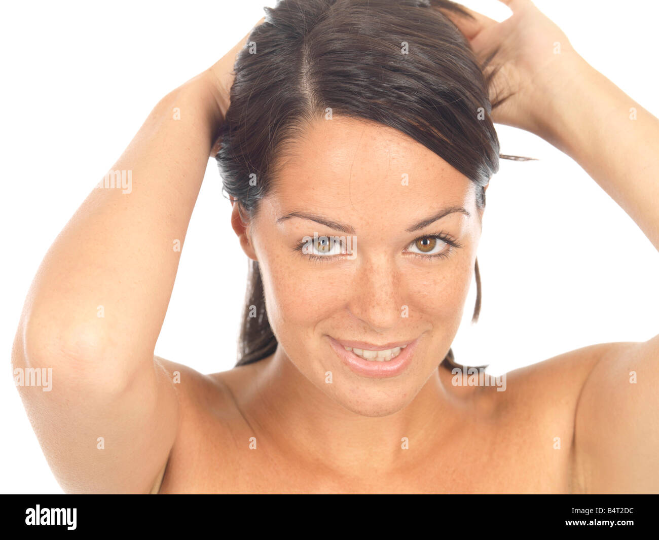 Woman tying hair up ponytail hi-res stock photography and images - Alamy