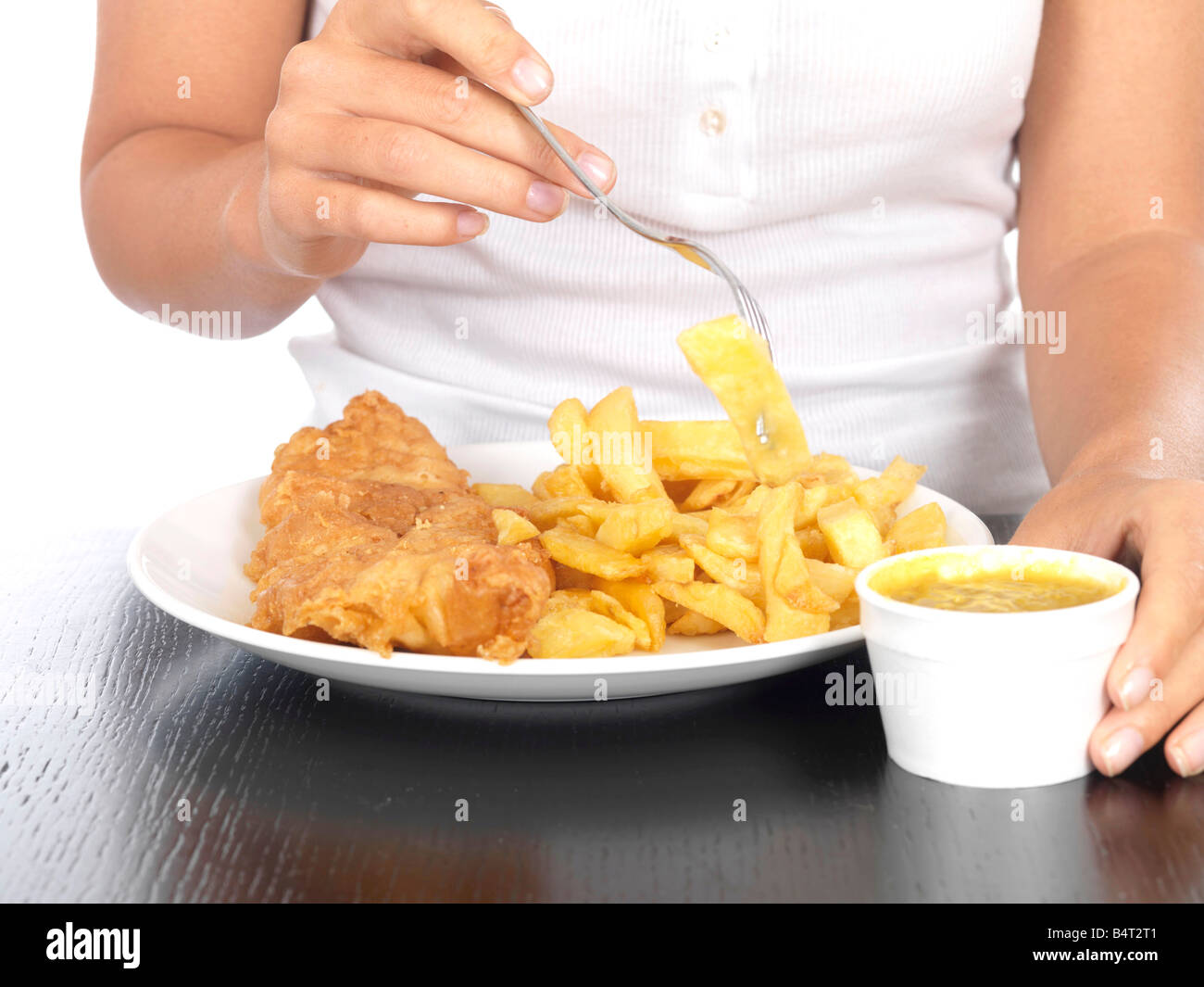 Young Woman Eating Fish and Chips Model Released Stock Photo - Alamy