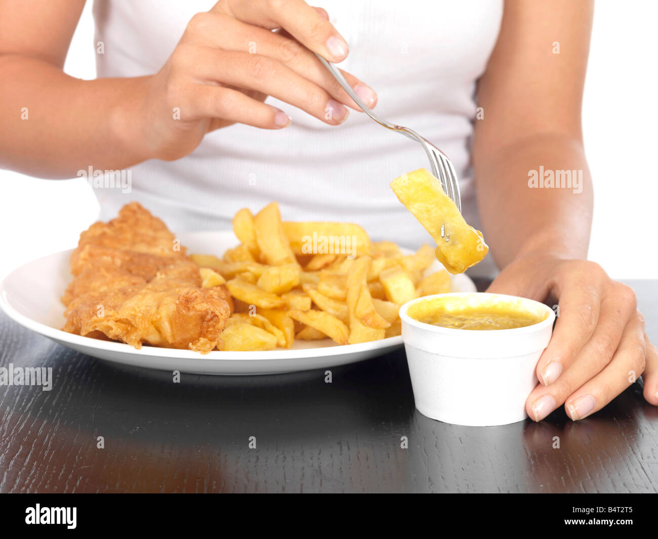 Young Woman Eating Fish and Chips Model Released Stock Photo - Alamy