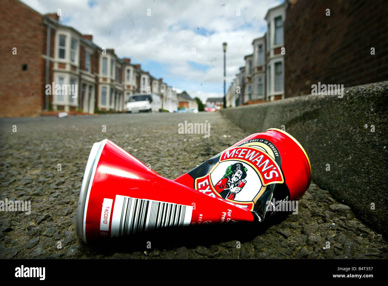 Picture of a discarded beer lager can lying in the street of terraced ...