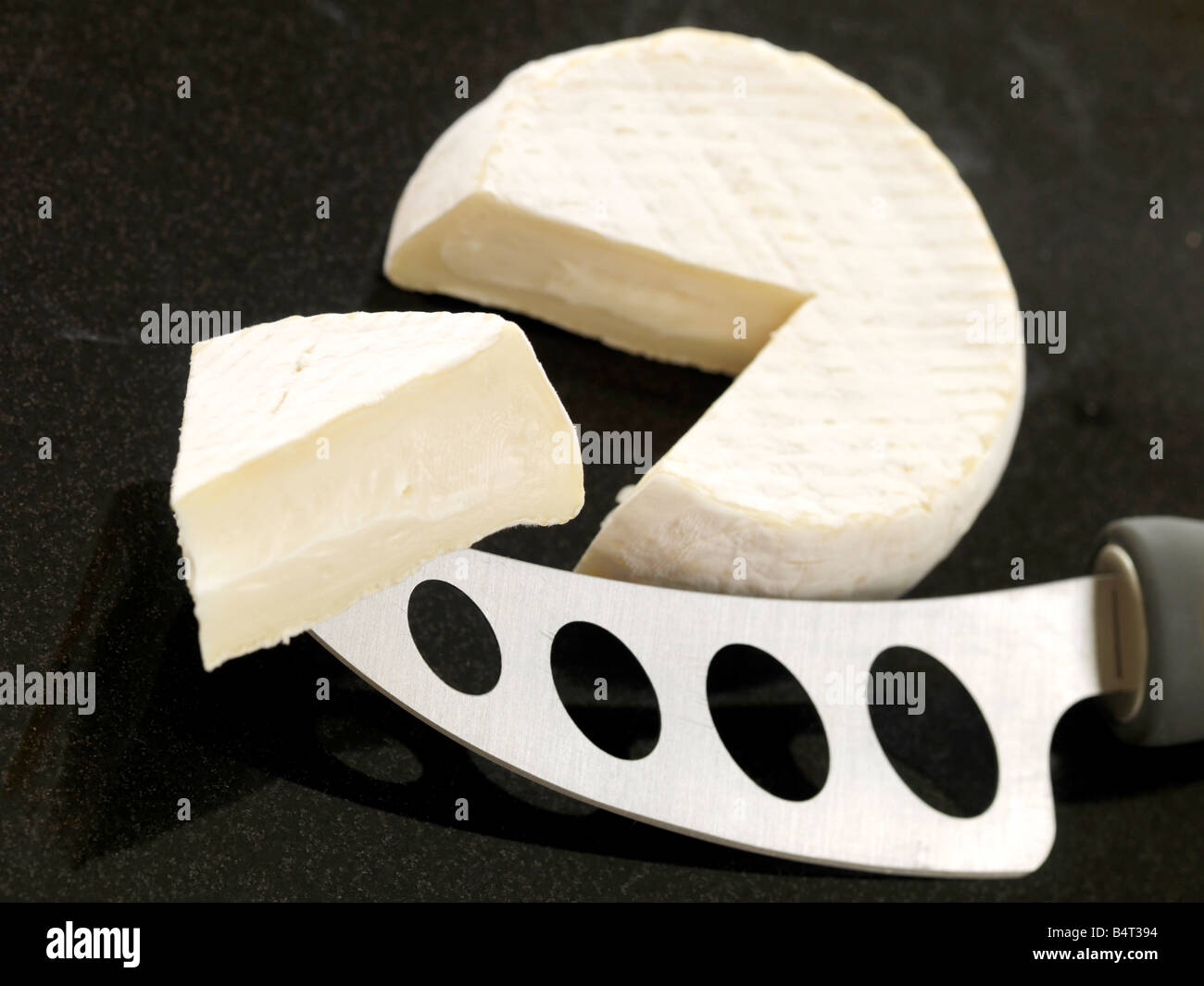 Cutting Goats Cheese Stock Photo - Alamy
