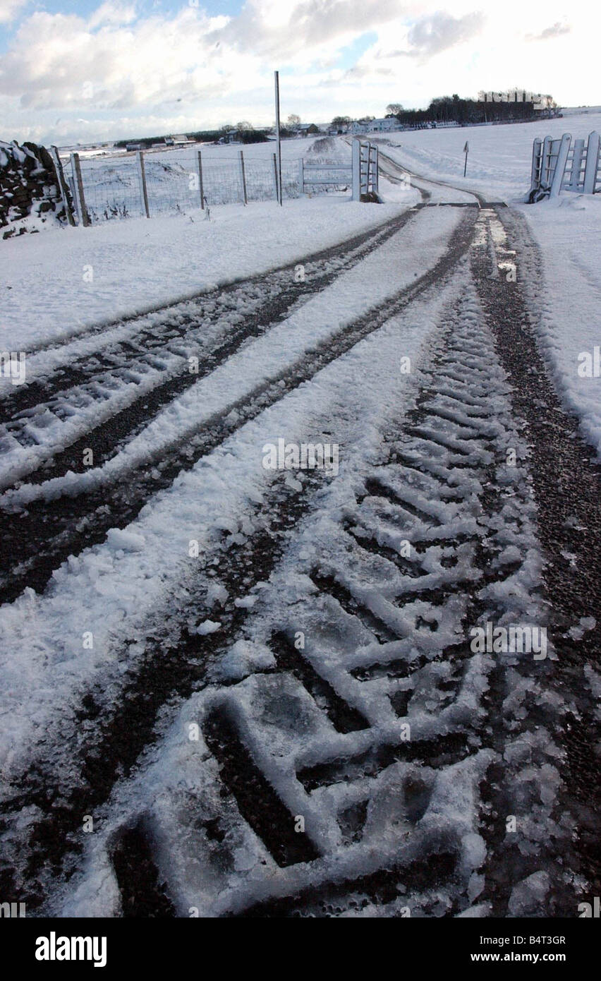 A tyre track in the snow Stock Photo - Alamy