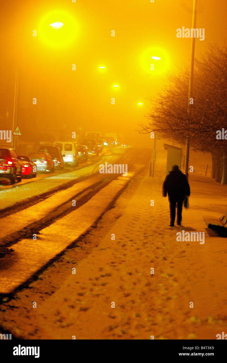 Snow pictures at Sunniside A lone pedestrian Stock Photo - Alamy
