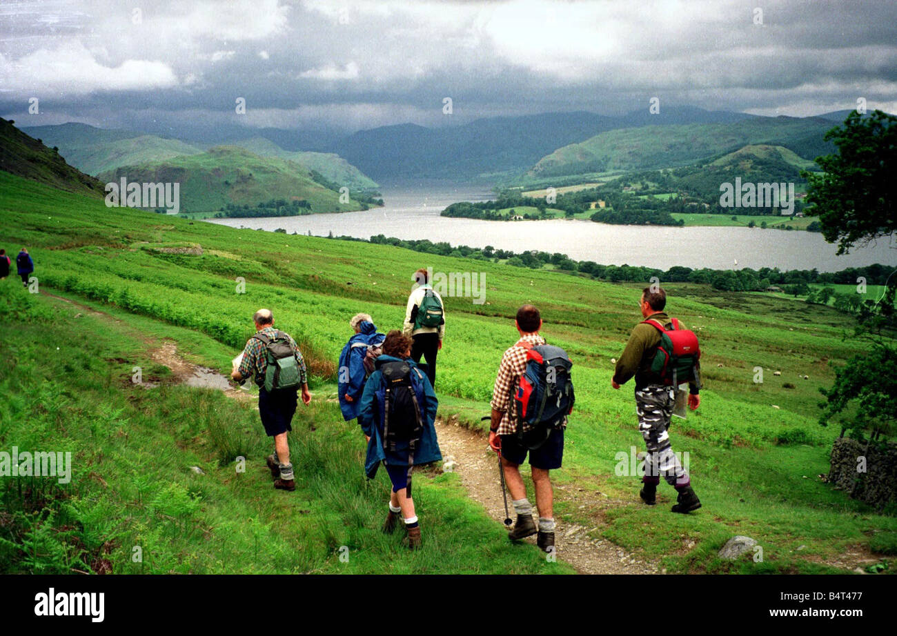 A group of hikers enjoying a walk in the countryside Stock Photo - Alamy