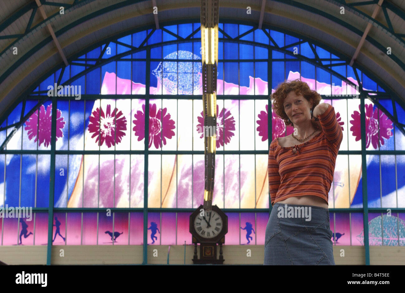 Swansea based artist Catrin Jones in front of her stained glass window ...