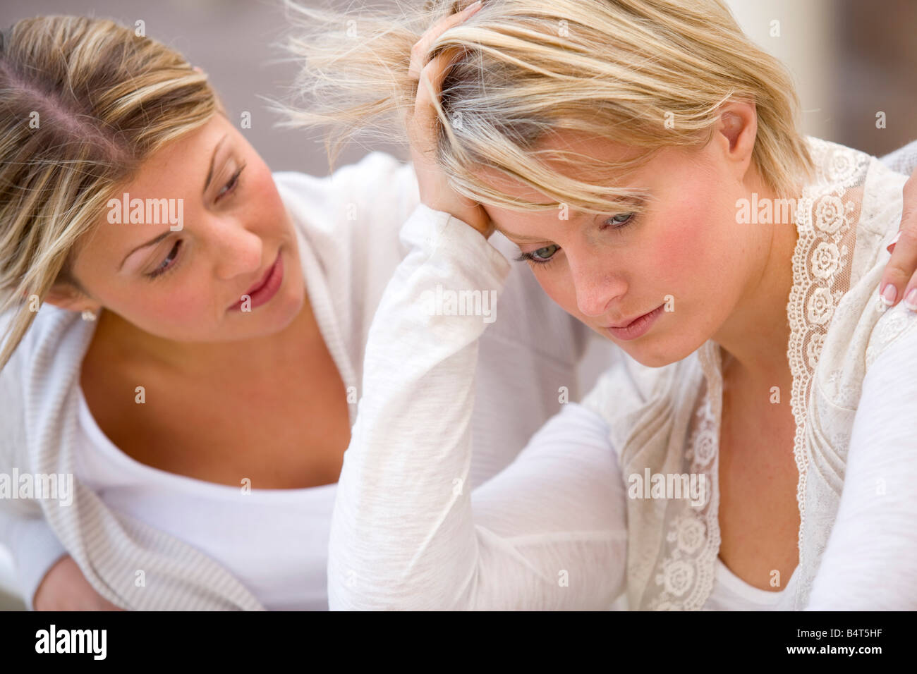 2 girls consoling Stock Photo - Alamy