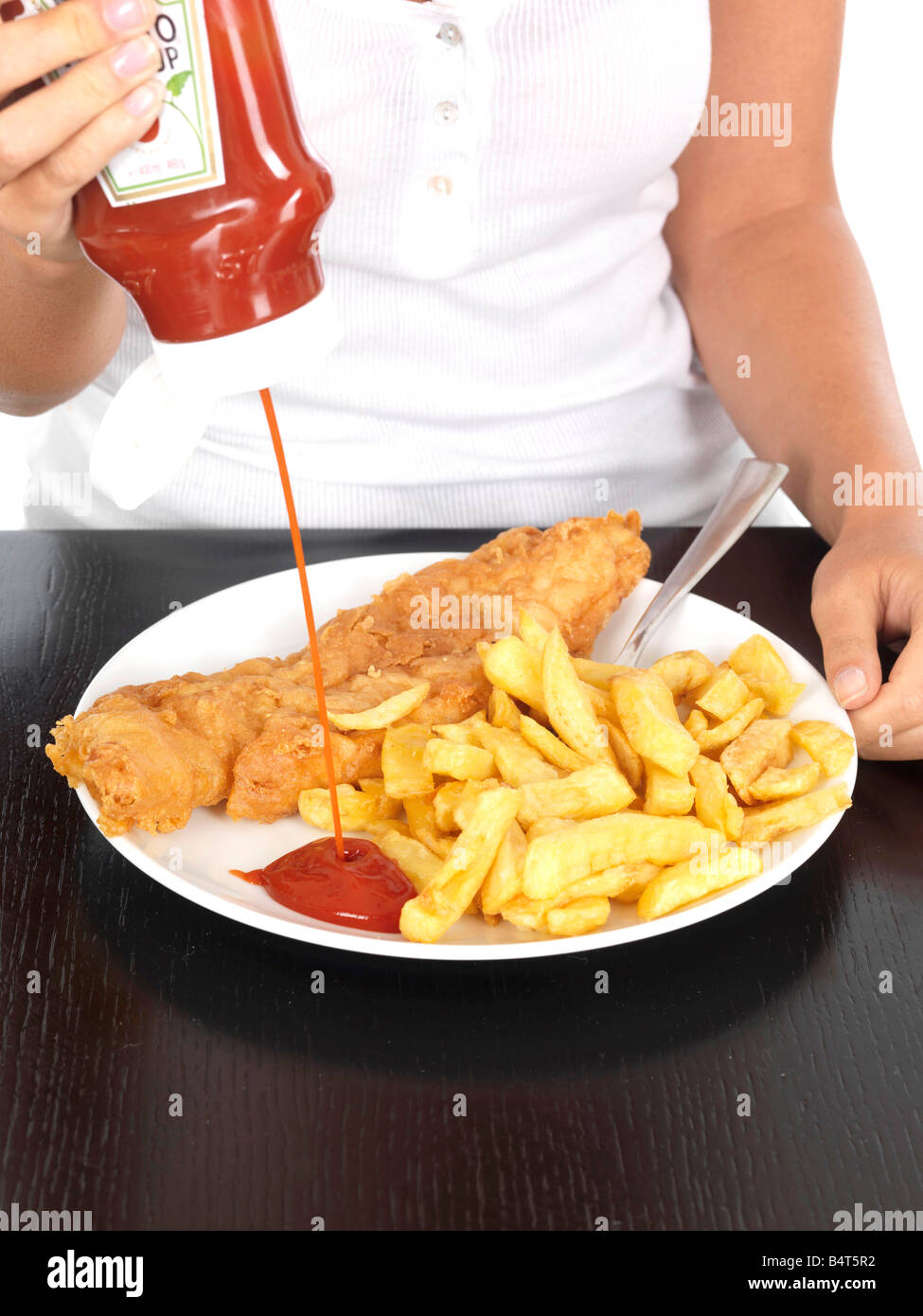 Young woman putting ketchup on hi-res stock photography and images - Alamy