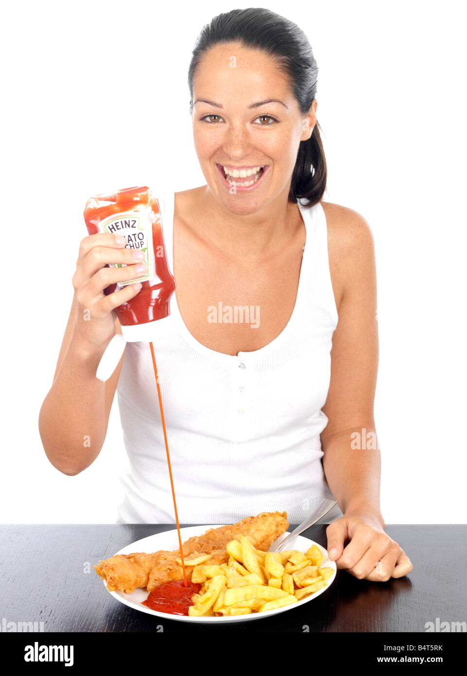 Young Woman Putting Ketchup on Fish and Chips Model Released Stock ...