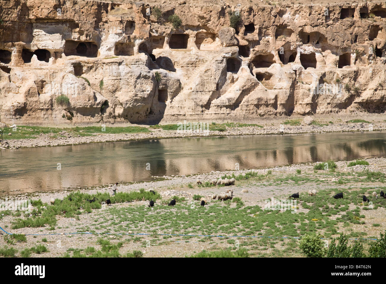 Turkey, Eastern Turkey, Hasankeyf, Caves reflecting in Tigris River ...