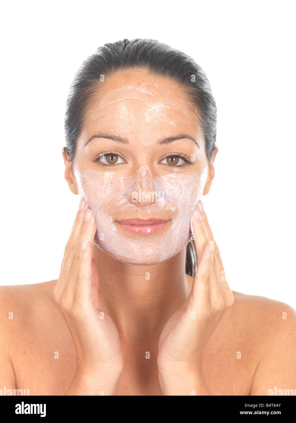 Young Woman With A Skin Cleansing Beauty Face Pack Isolated Against A ...