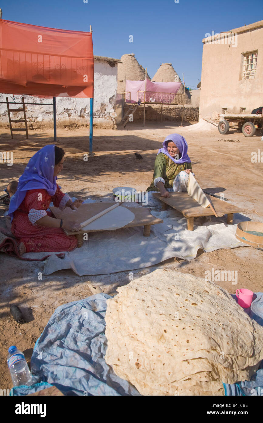 Turkey, Eastern Turkey, Harran, Women making bread in outside ...