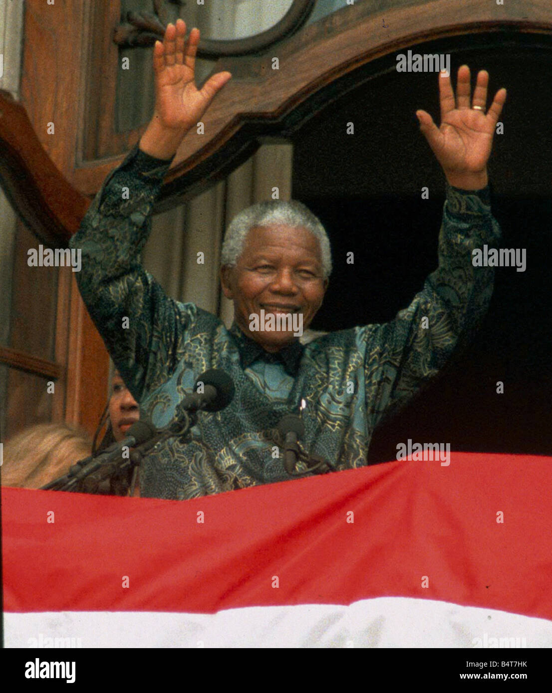 Nelson mandela waves to the crowd in Trafalgar Square during his visit ...