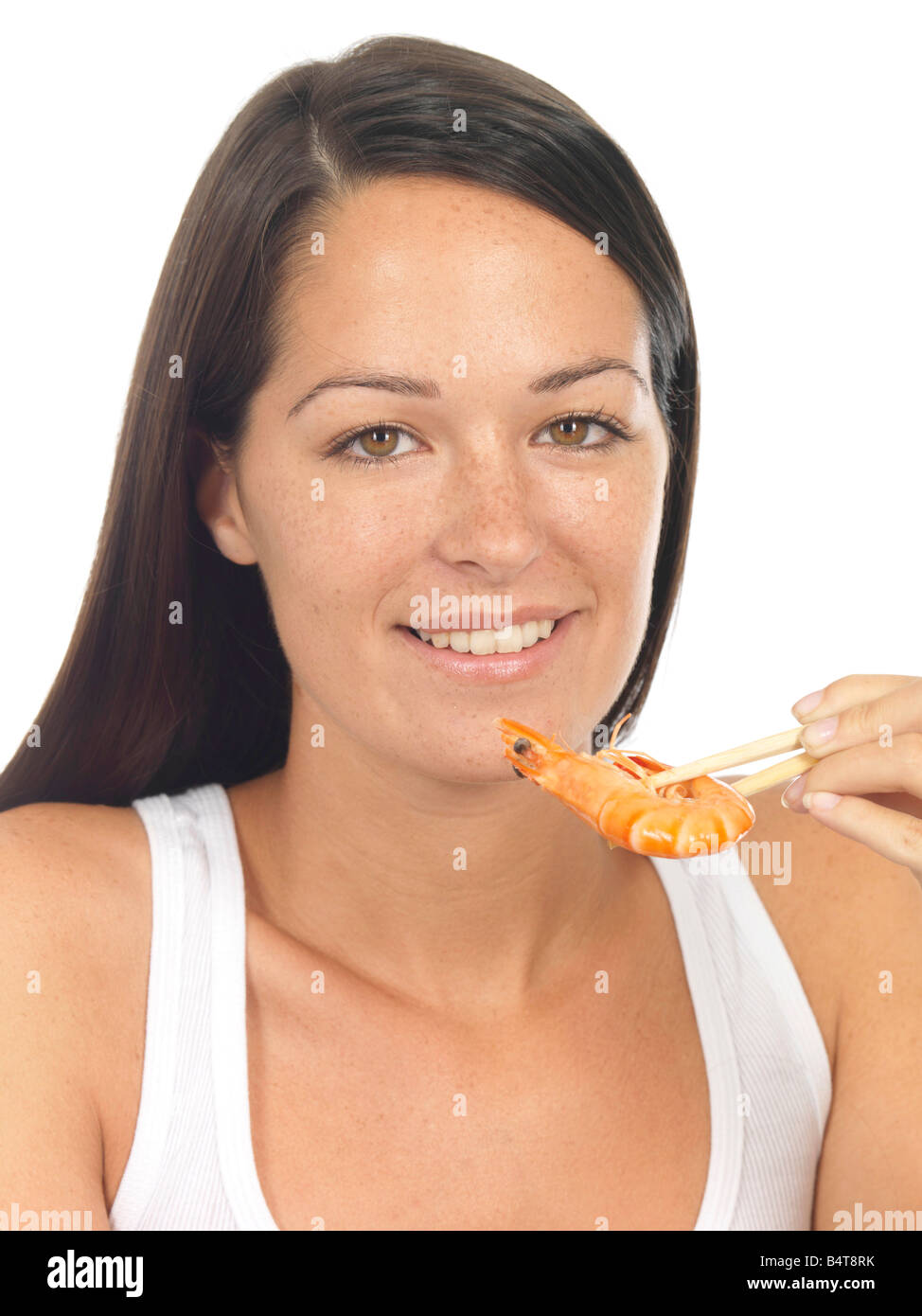 Healthy Young Woman Eating A Prawn Using Chopsticks Isolated Against A ...