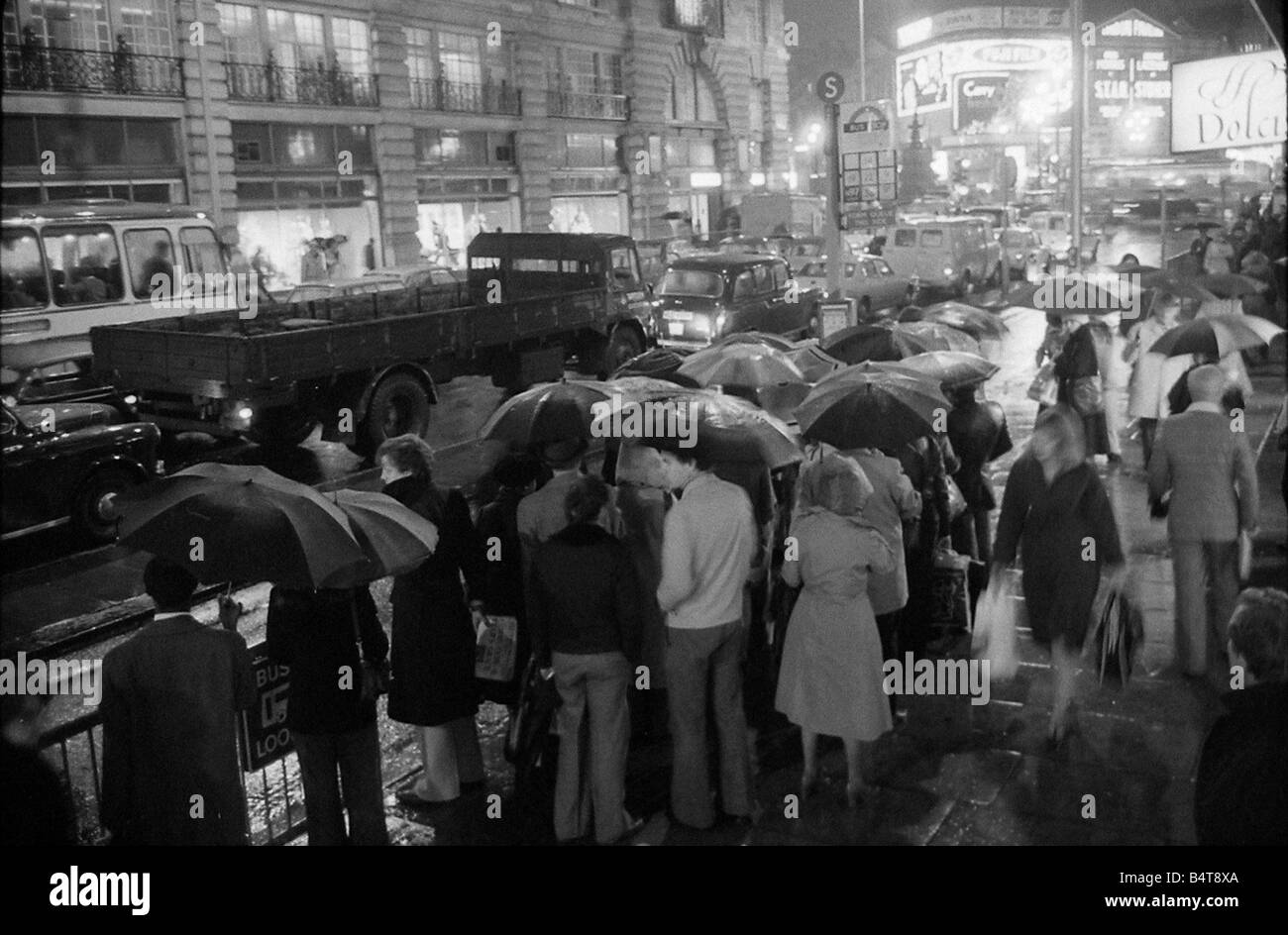 London travellers are soaked by the rain as the end of the 1976 drought ...