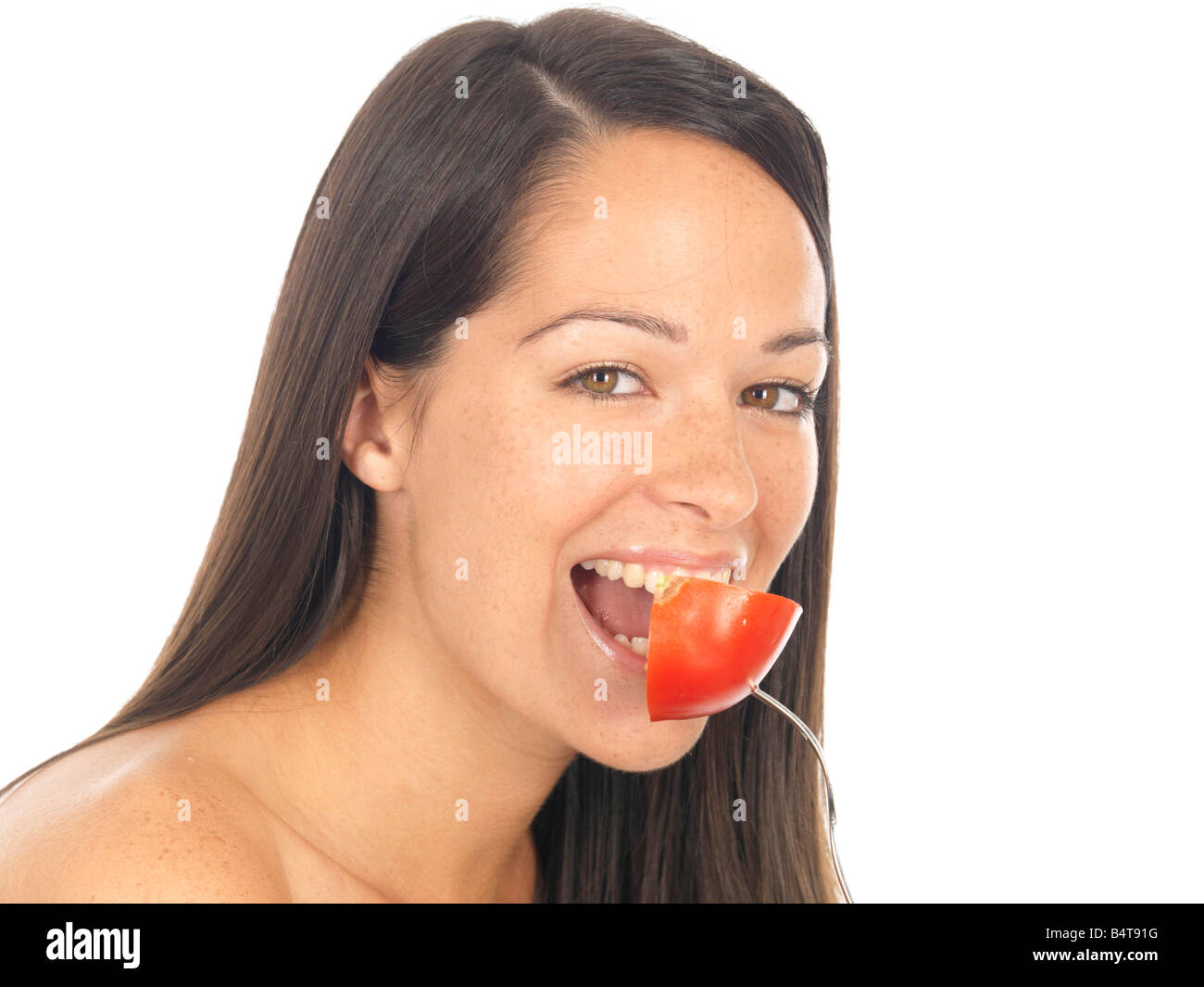 Young Woman Eating Beef Tomato Model Released Stock Photo - Alamy