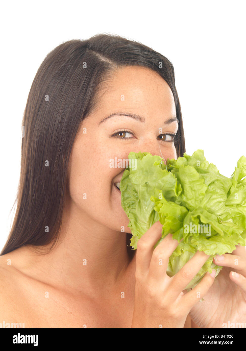 Healthy Young Woman Holding And Eating Fresh Lettuce Isolated Against A ...