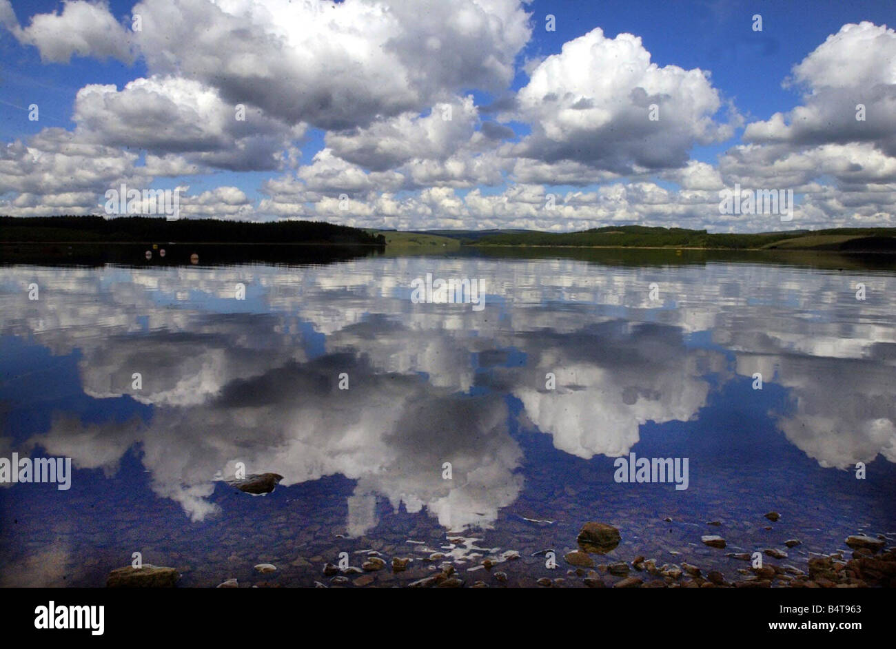 Kielder Water on a still day with the clouds reflected in the water ...