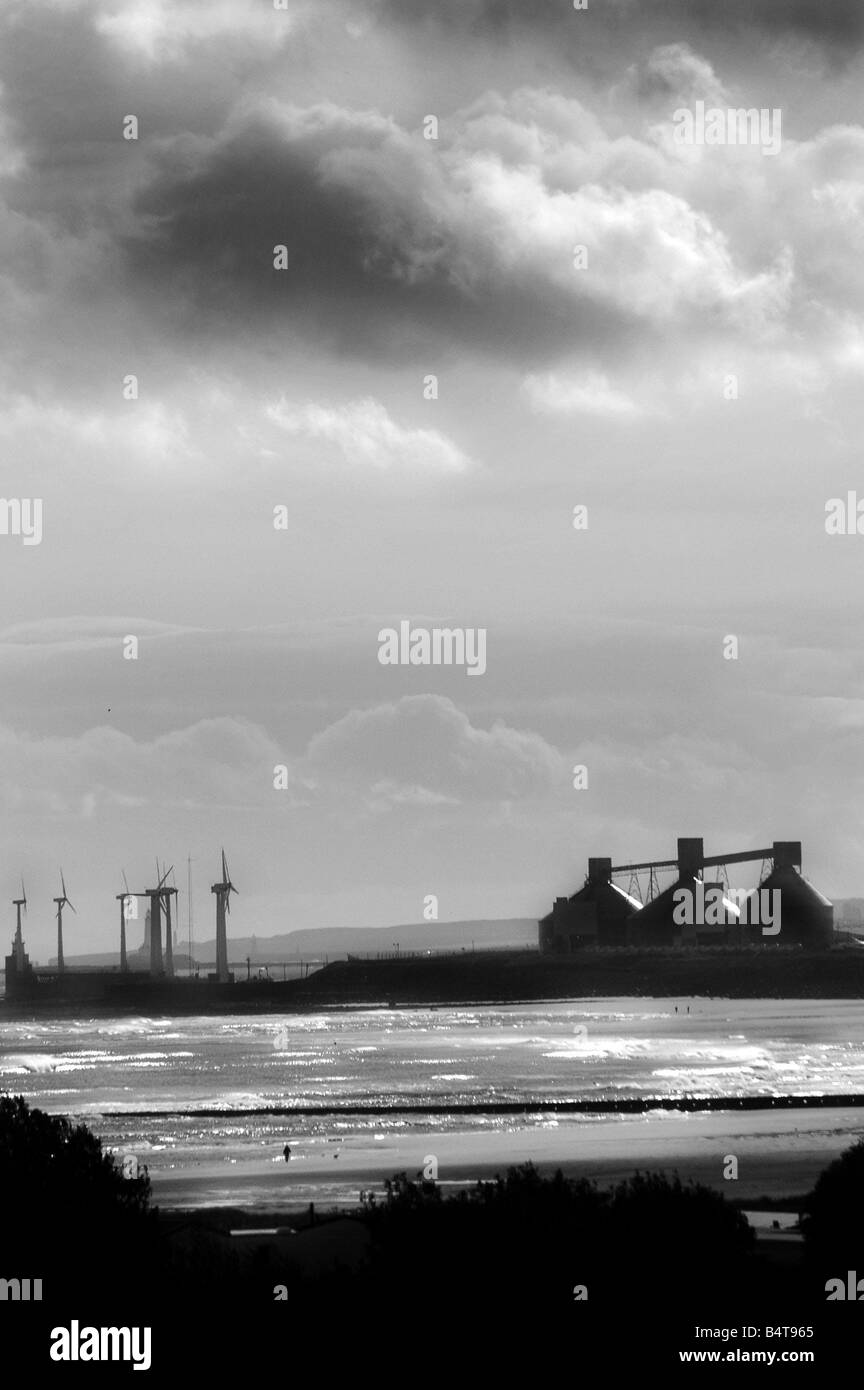 The wind turbines and storage silos at Blyth harbour on a blustery day ...