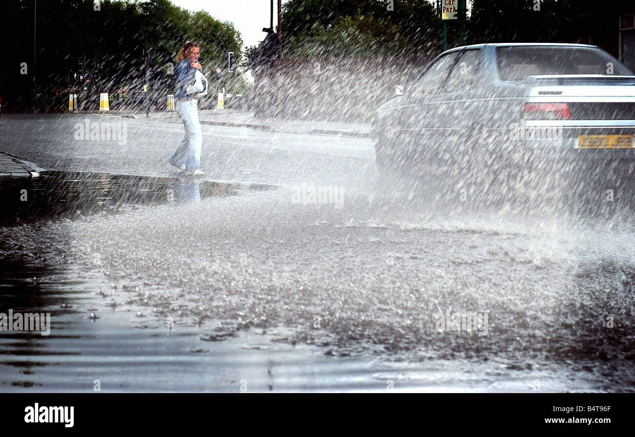 A young girl tries to cross the road in Heaton after being splashed by ...
