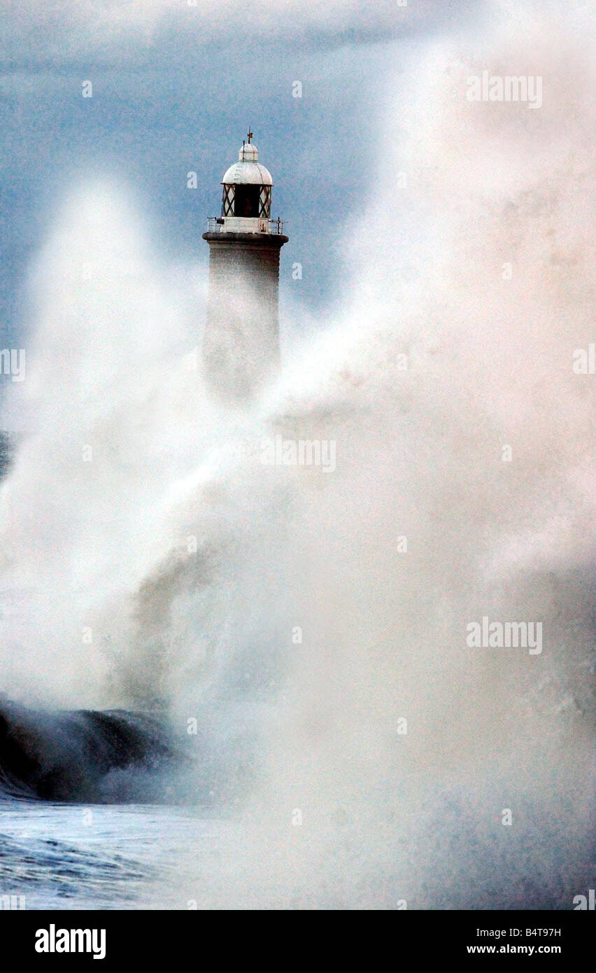 Tynemouth pier battered by waves during a storm Stock Photo - Alamy