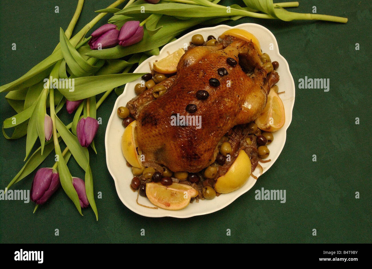 Braised duck with olives and lemons Stock Photo - Alamy