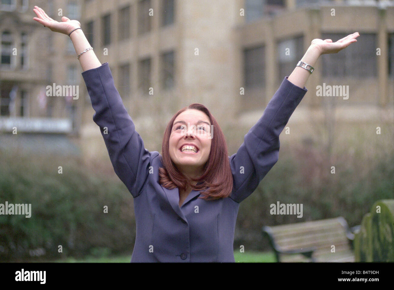 A young woman looking happy excited thrilled Stock Photo - Alamy