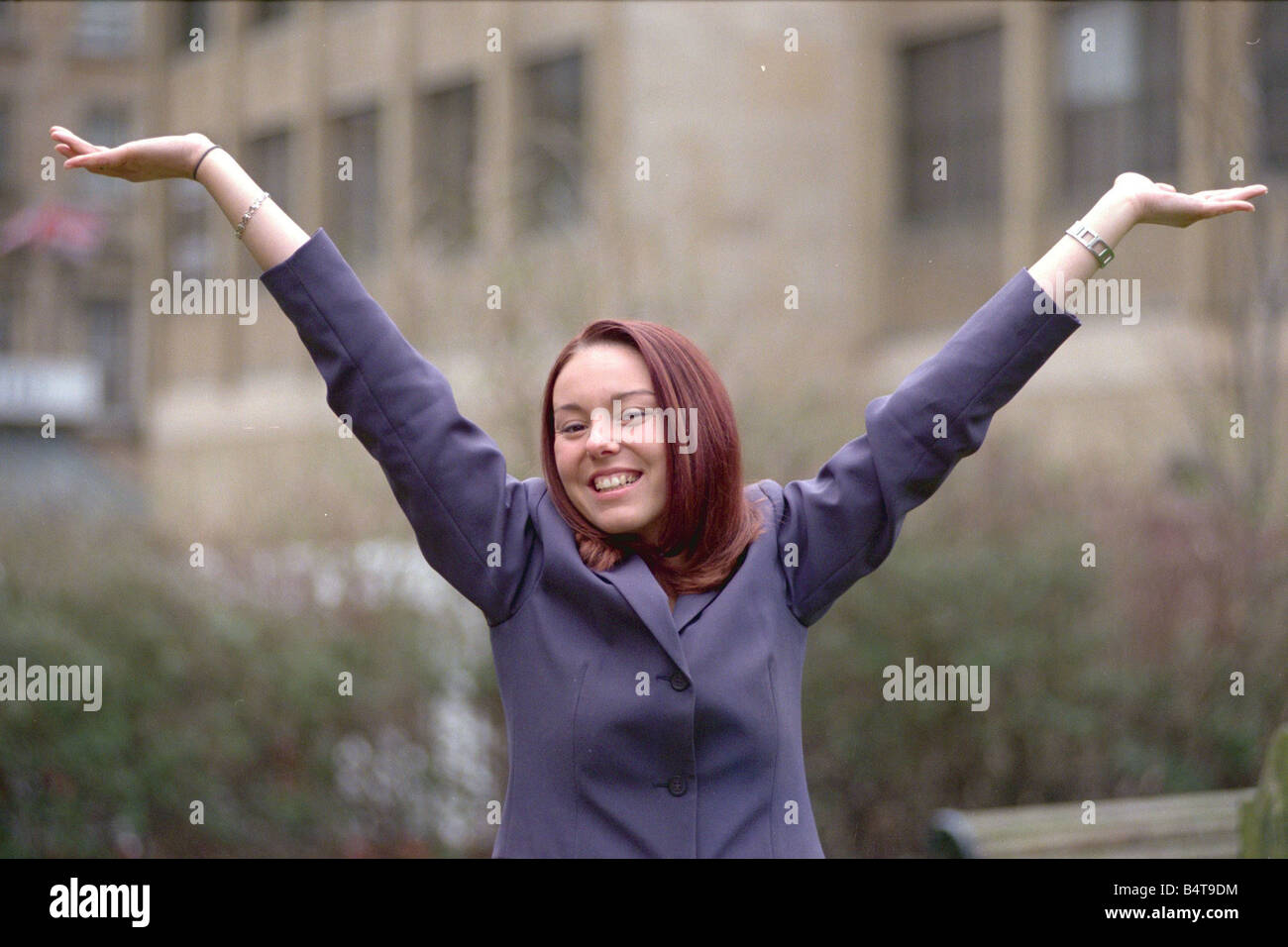A young woman looking happy excited thrilled Stock Photo - Alamy