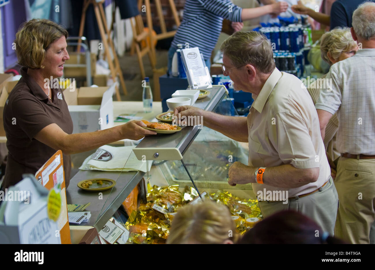 People browse and buy on stalls Market Hall at Abergavenny Food ...