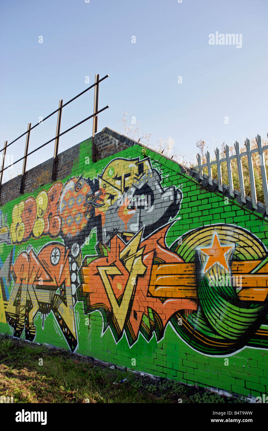 graffiti on the wall below a railway line art wallart community project ...